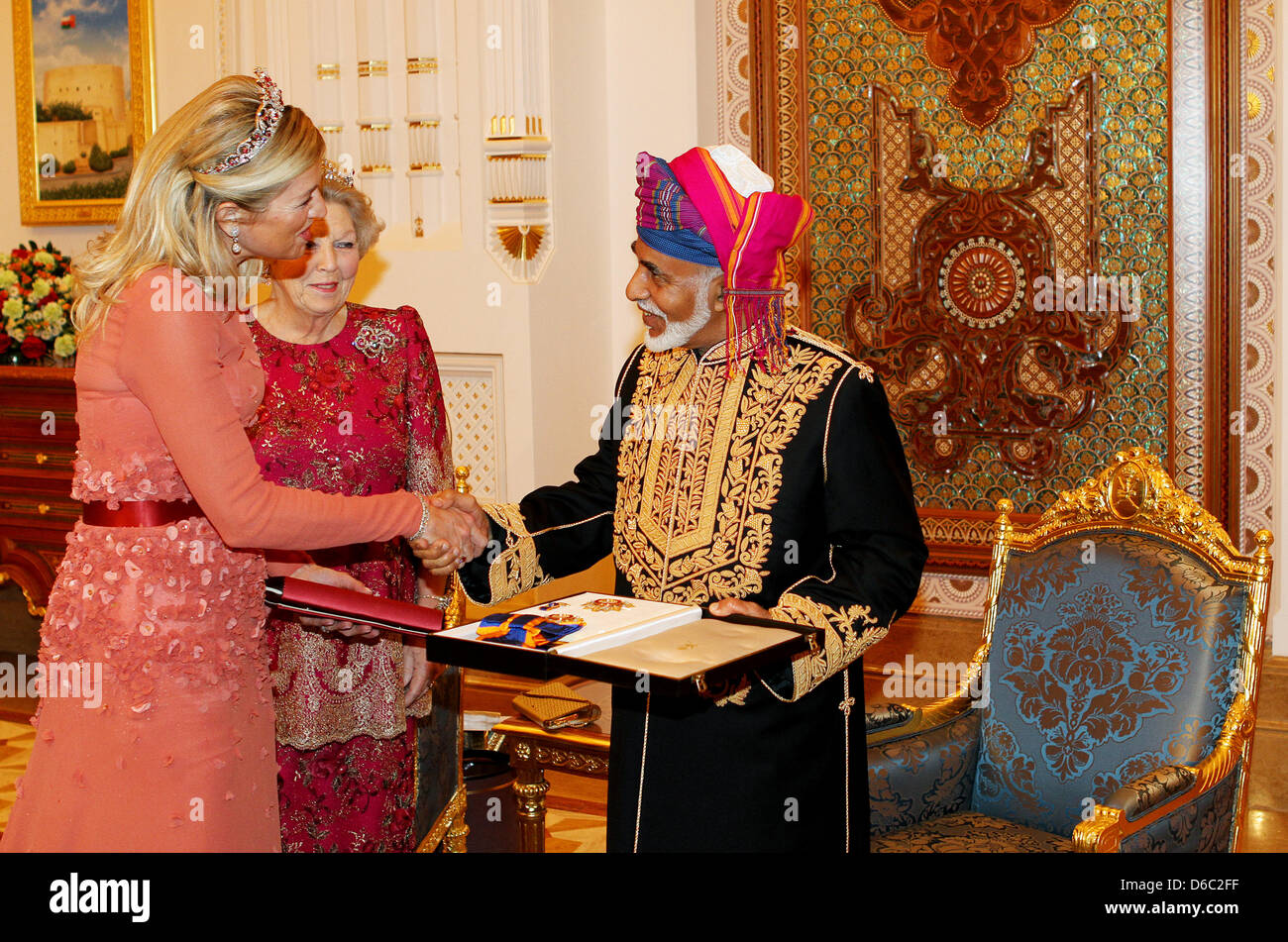 Dutch Princess Maxima (L) receives a present from Sultan Qaboos bin ...