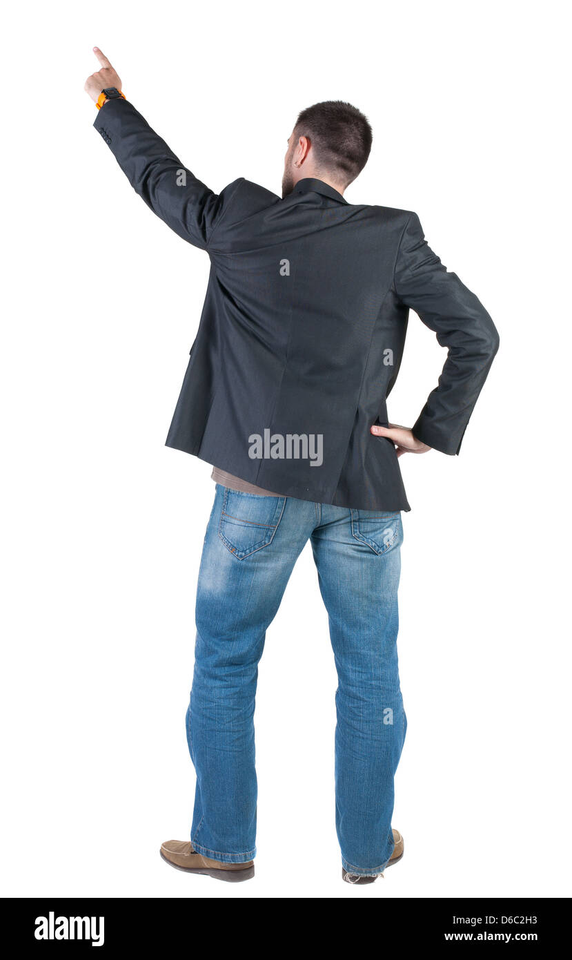 young man pointing at wall. rear view. Isolated over white Stock Photo ...