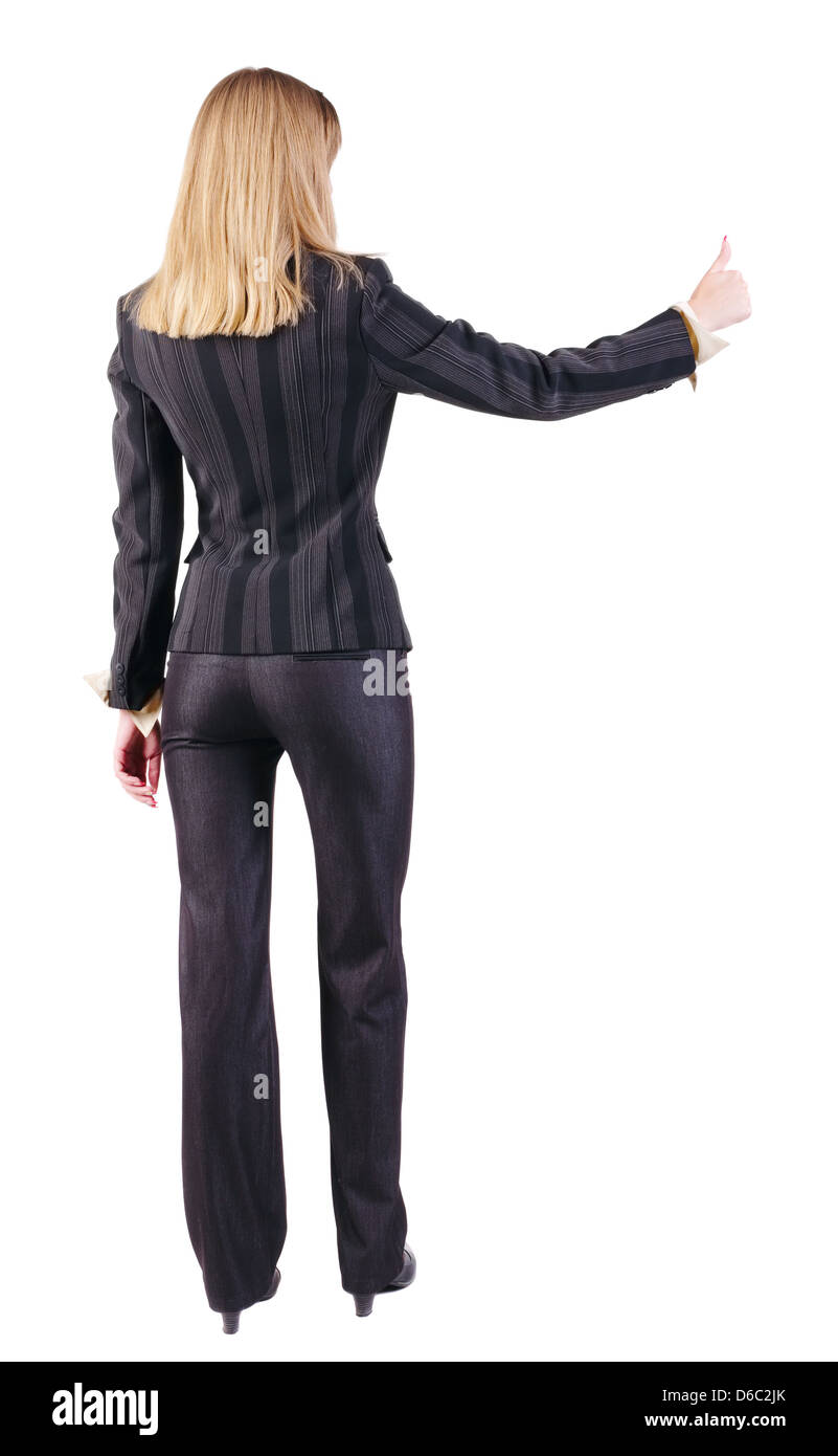 back view of standing young blonde business woman showing thumb up ...