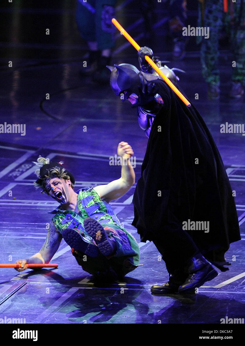 Actor Sam Heughan (R) performs on stage during the show 'Batman Live ...