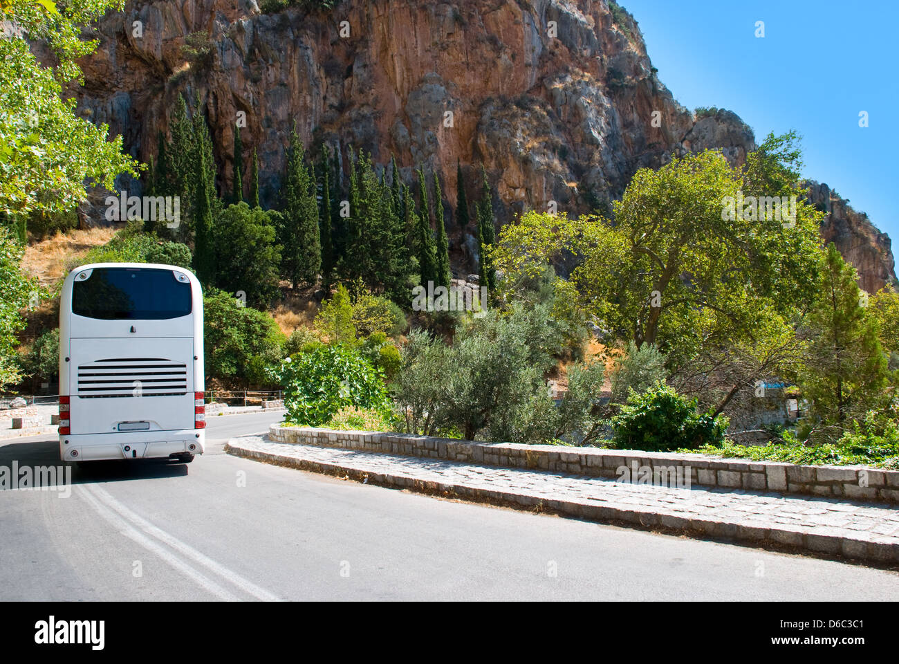 The modern tourist bus on mountain road Stock Photo - Alamy
