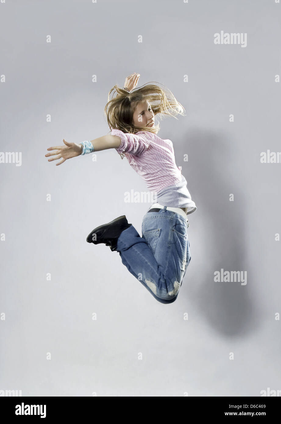 Teenage girl dancing breakdance in action Stock Photo - Alamy