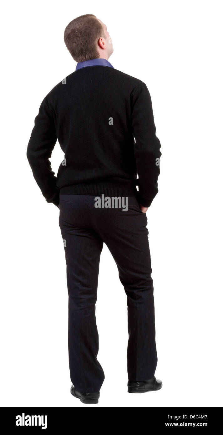 Back view of business man looks ahead. Young guy in sweater watching ...