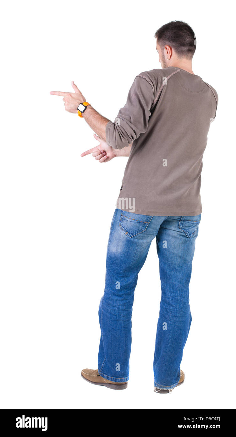young man pointing at wall. rear view. Isolated over white Stock Photo ...