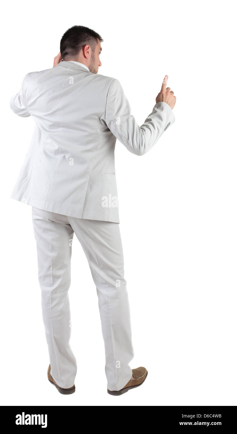 Back view of thinking young business man in white suit. Rear view ...