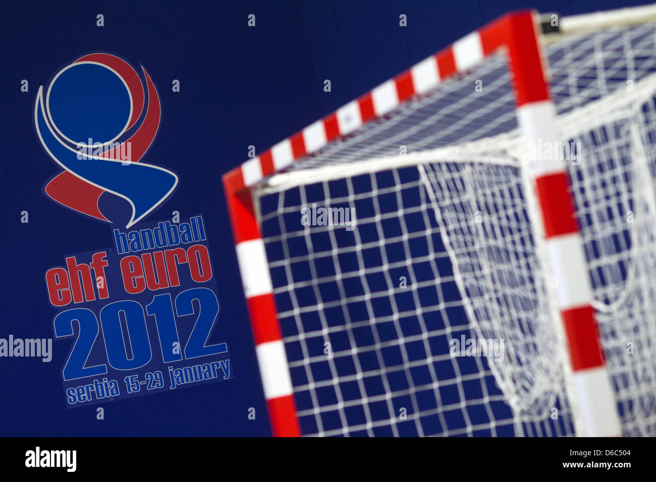 The logo of the European Handball Championships hangs next to a goal on ...