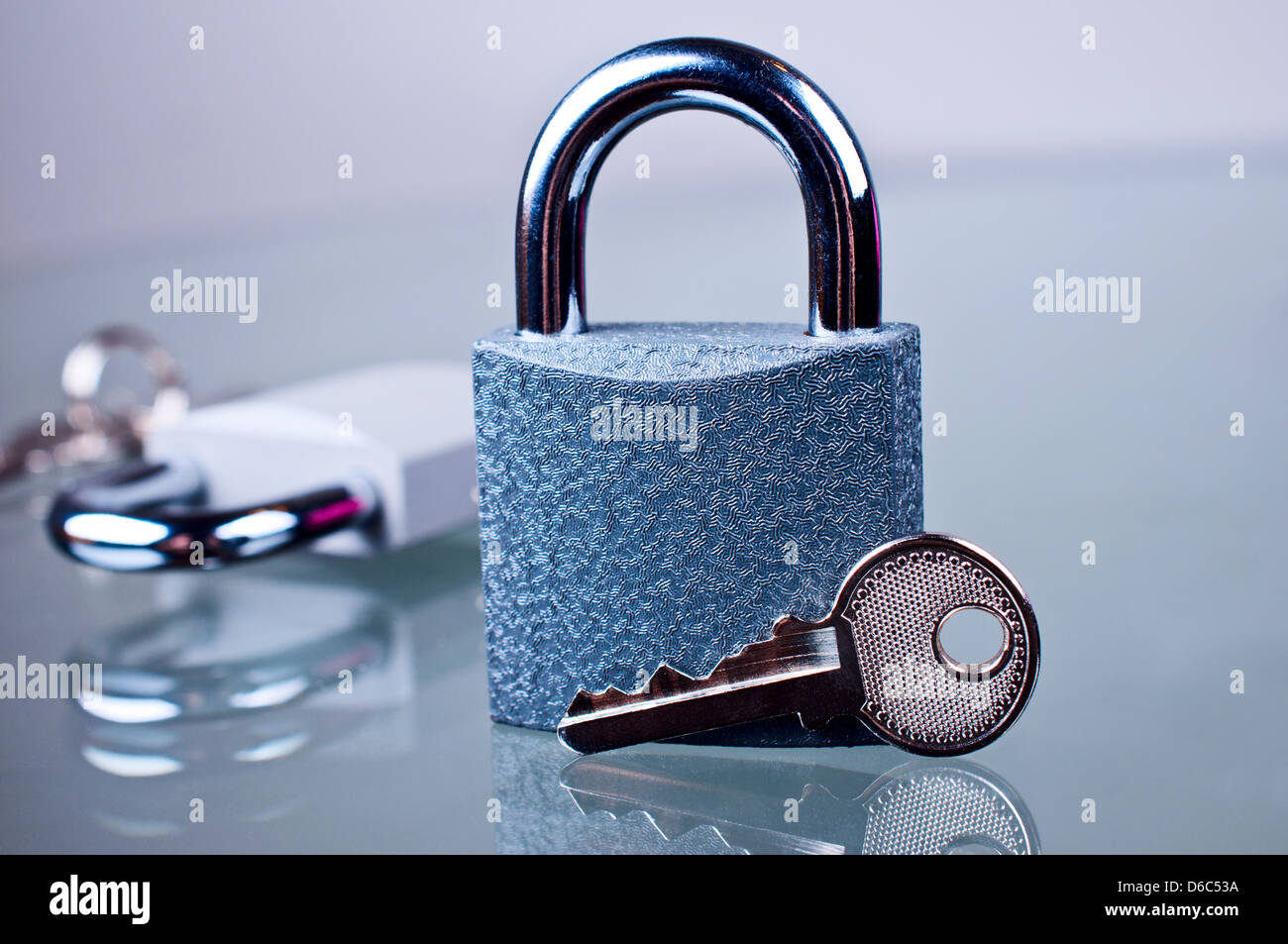 Padlock with a key Stock Photo - Alamy