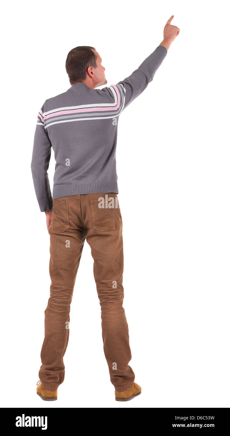 Back view of pointing young men in sweater and jeans. Young guy gesture ...