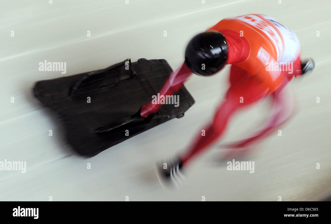 A skeleton pilot starts a run during the Skeleton World Cup in ...