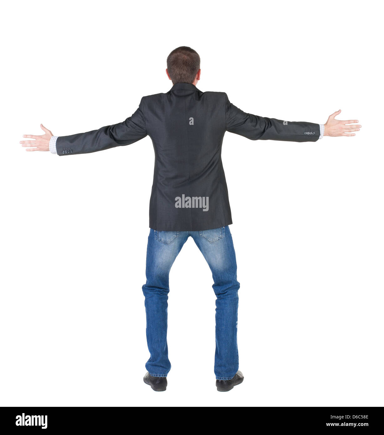 Back view of shocked and scared young business man. Holds hands upwards ...