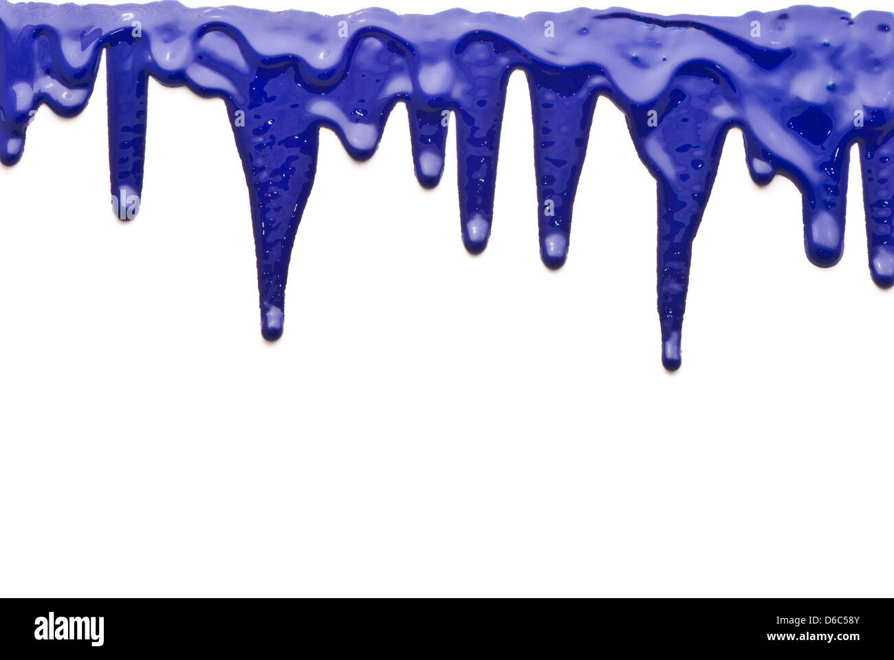 Blue paint pouring on white background Stock Photo - Alamy