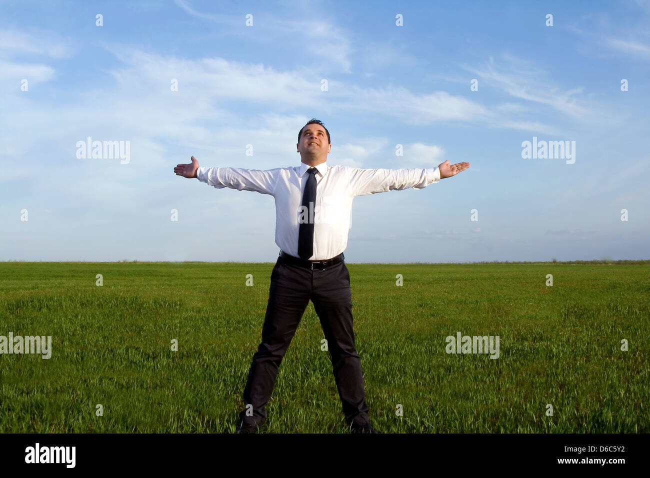 businessman take energy from nature Stock Photo - Alamy