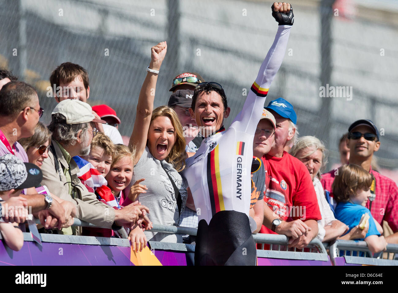 Michael Teuber (C) of Germany celebrates with his wife Susanne after ...