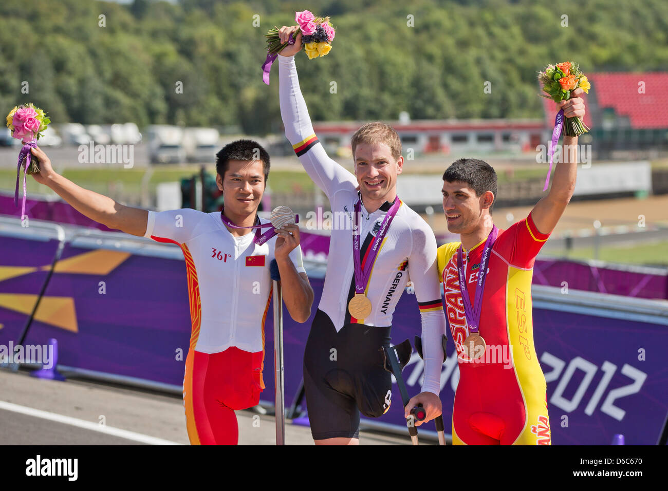 Gold medalist Tobias Graf (C) of Germany celebrates with silver ...