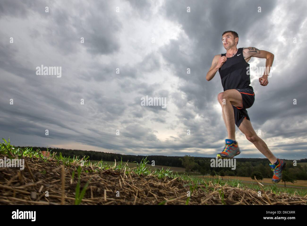 The long-distance alpine runner Christian Seiler practices near his ...