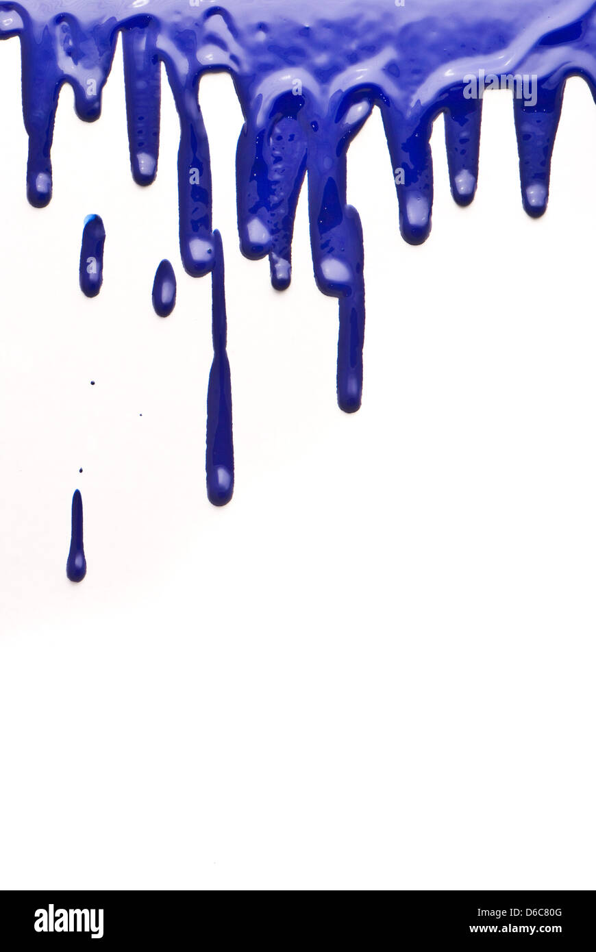 Blue paint pouring on white background Stock Photo - Alamy
