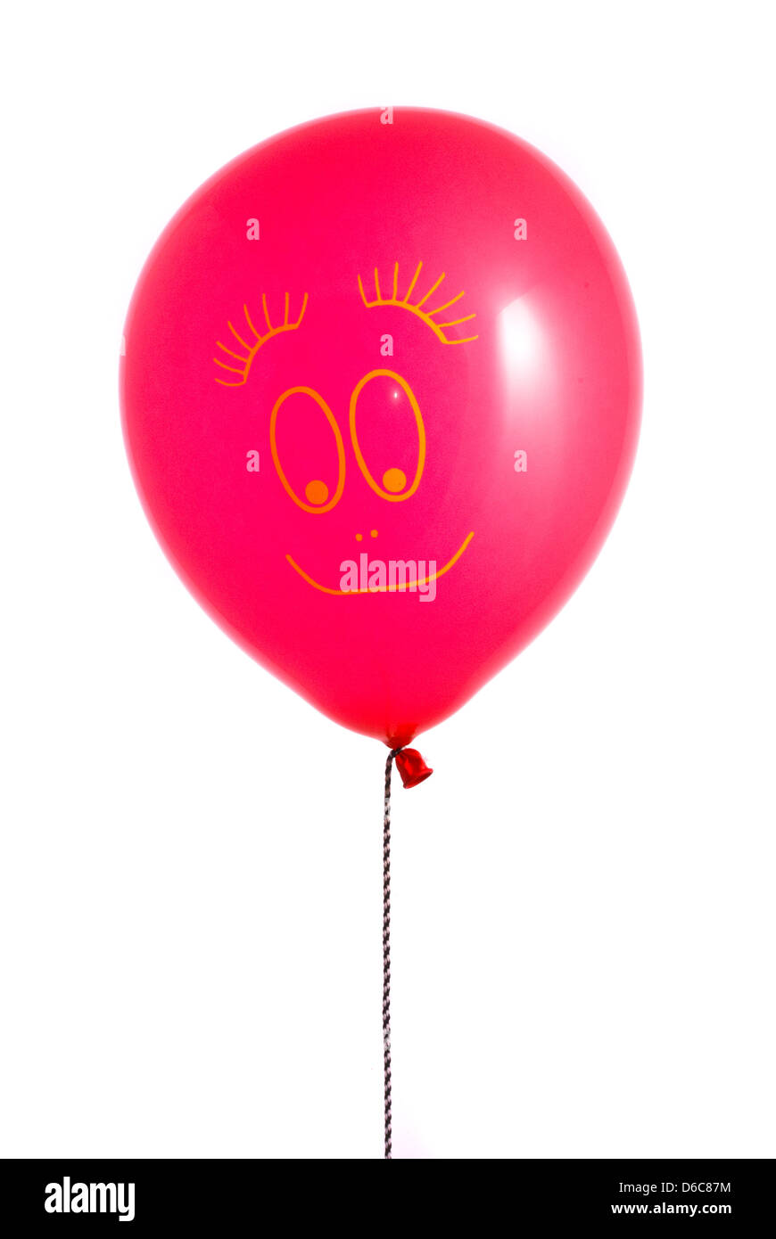 Red balloon with smile on white background Stock Photo - Alamy