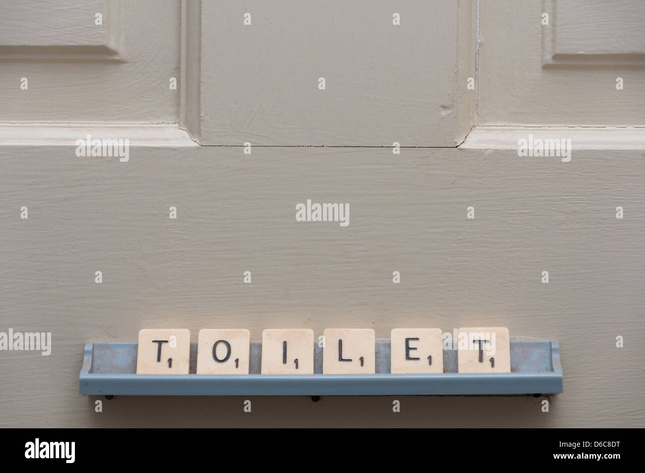 Toilet sign on door Stock Photo - Alamy