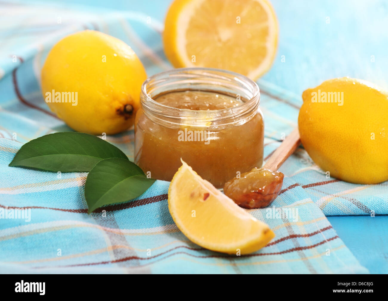 Jar of lemon jam and some lemons Stock Photo - Alamy