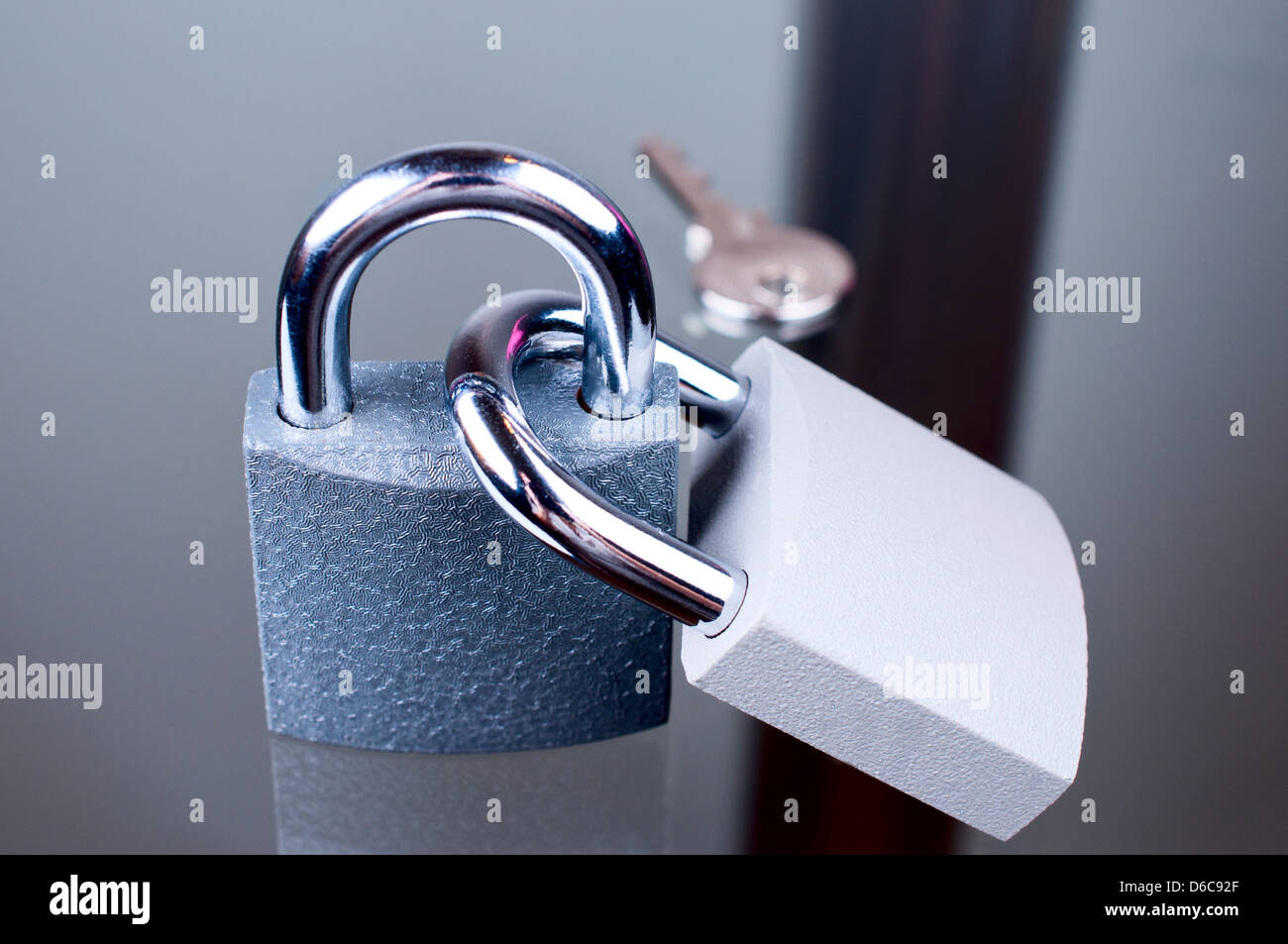 Two padlocks with a key Stock Photo - Alamy