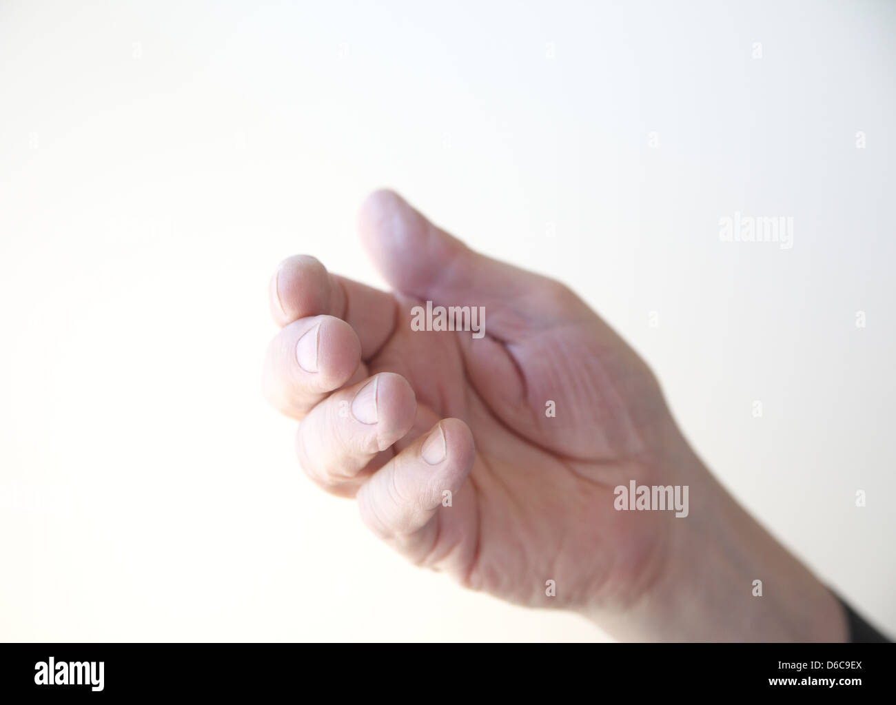 an older man illustrates a point with the help of a hand gesture Stock ...