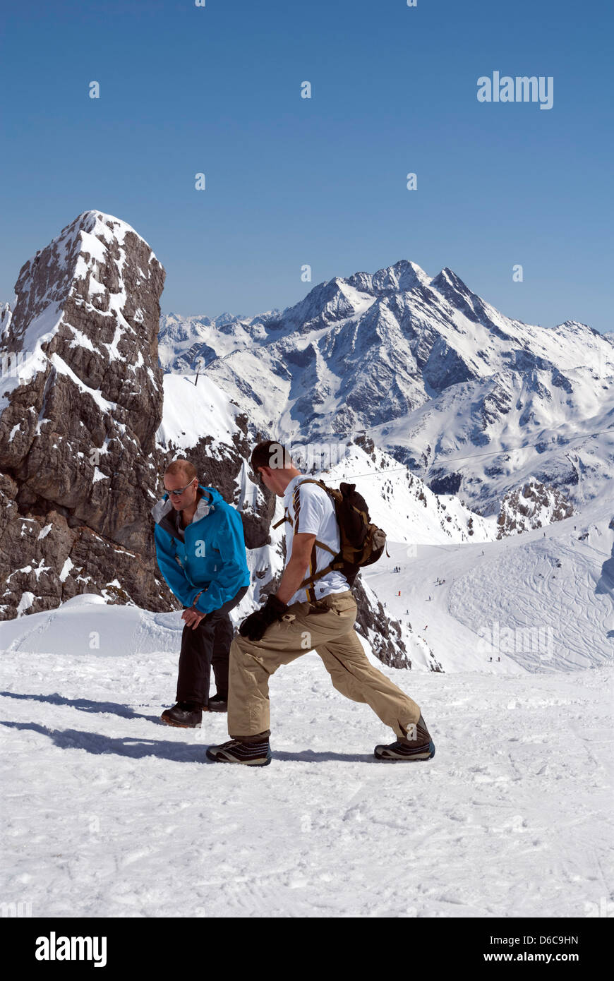 Performing pre-skiing warm-up exercises, at altitude, in the Austrian ...