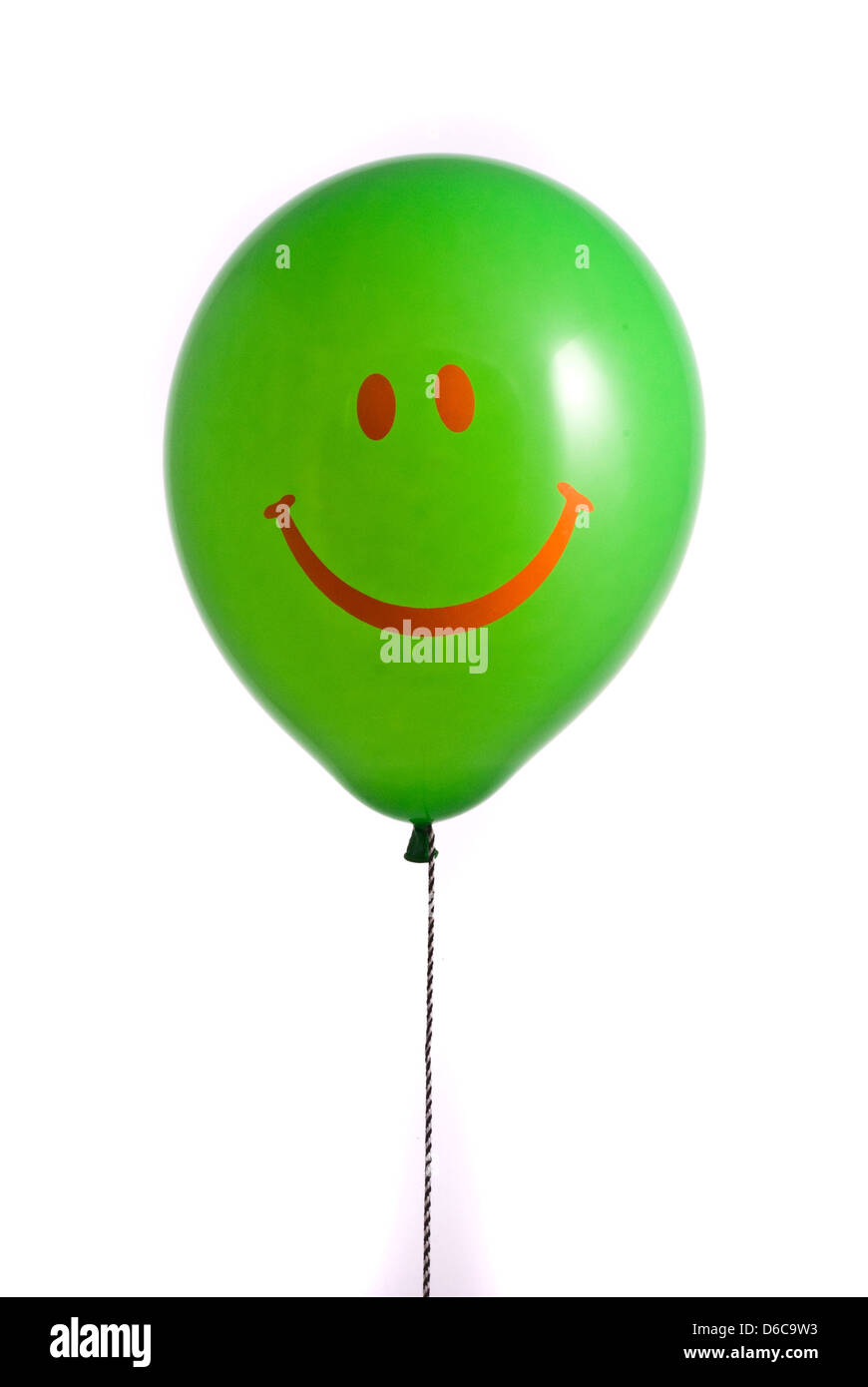 Green balloon with smile on white background Stock Photo - Alamy