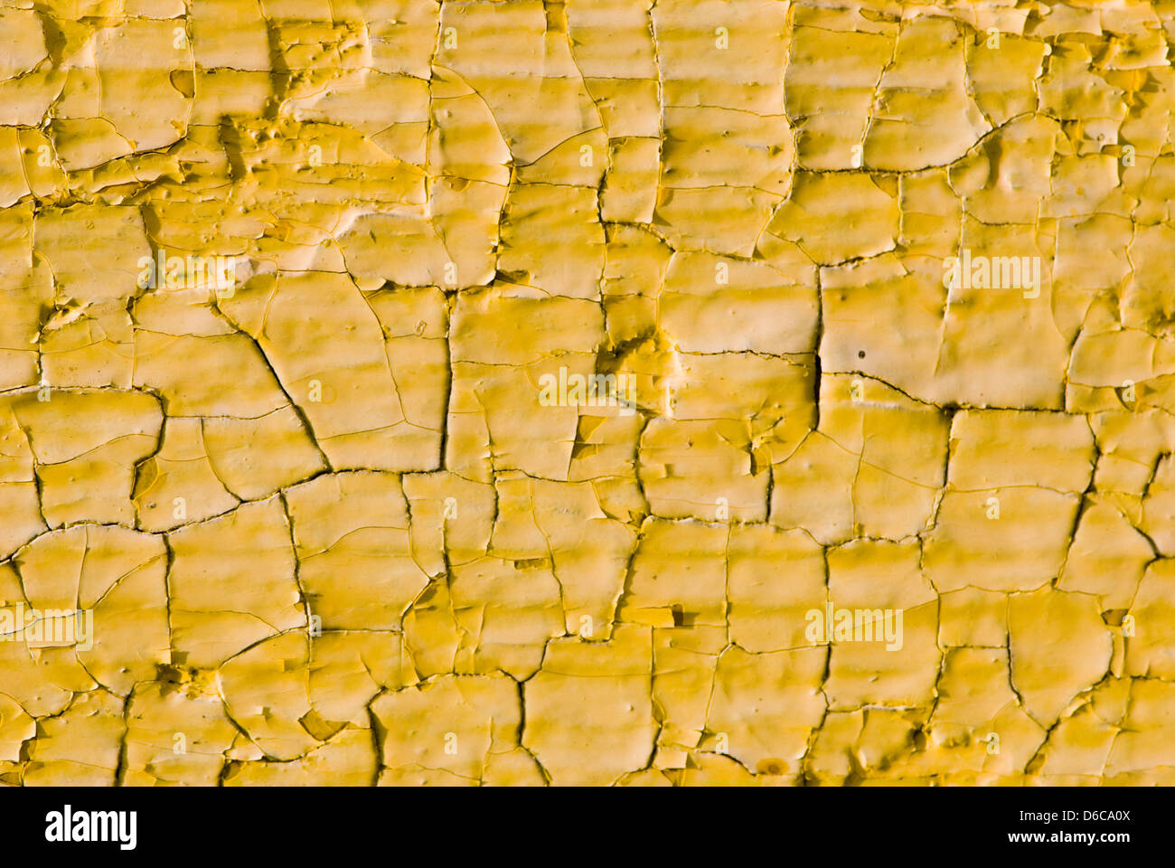 Yellow cracked paint Stock Photo - Alamy