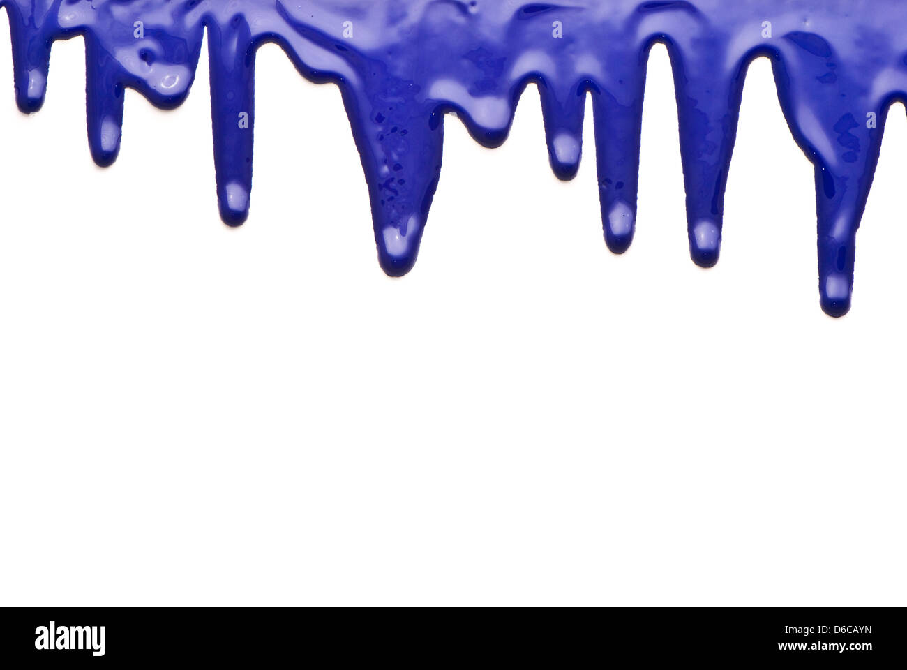 Blue paint pouring on white background Stock Photo - Alamy