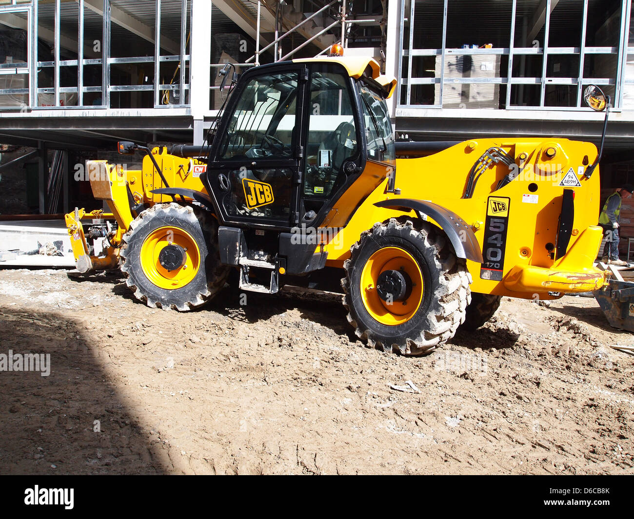 Telehandler fork lift on a busy construction site, April 2013 Stock ...
