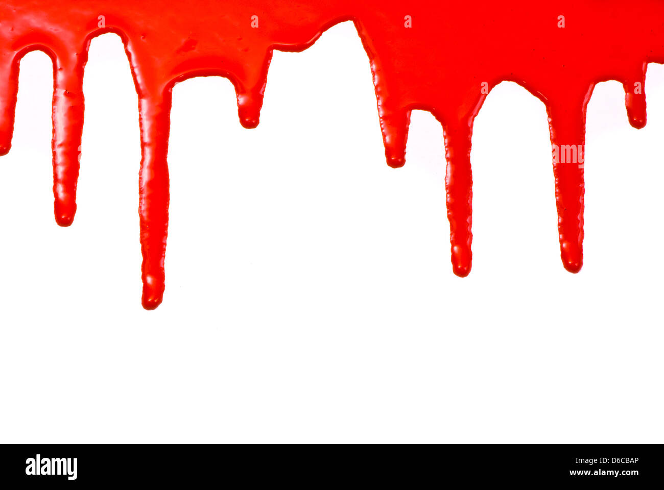 Red paint pouring on white background Stock Photo - Alamy