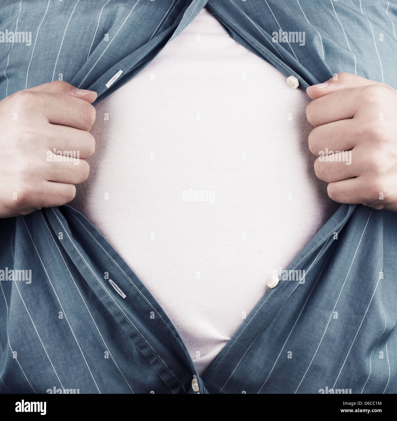 Business man tearing off his shirt Stock Photo - Alamy