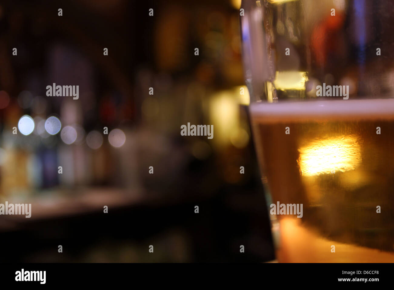 blurry beer mug in a bar Stock Photo - Alamy