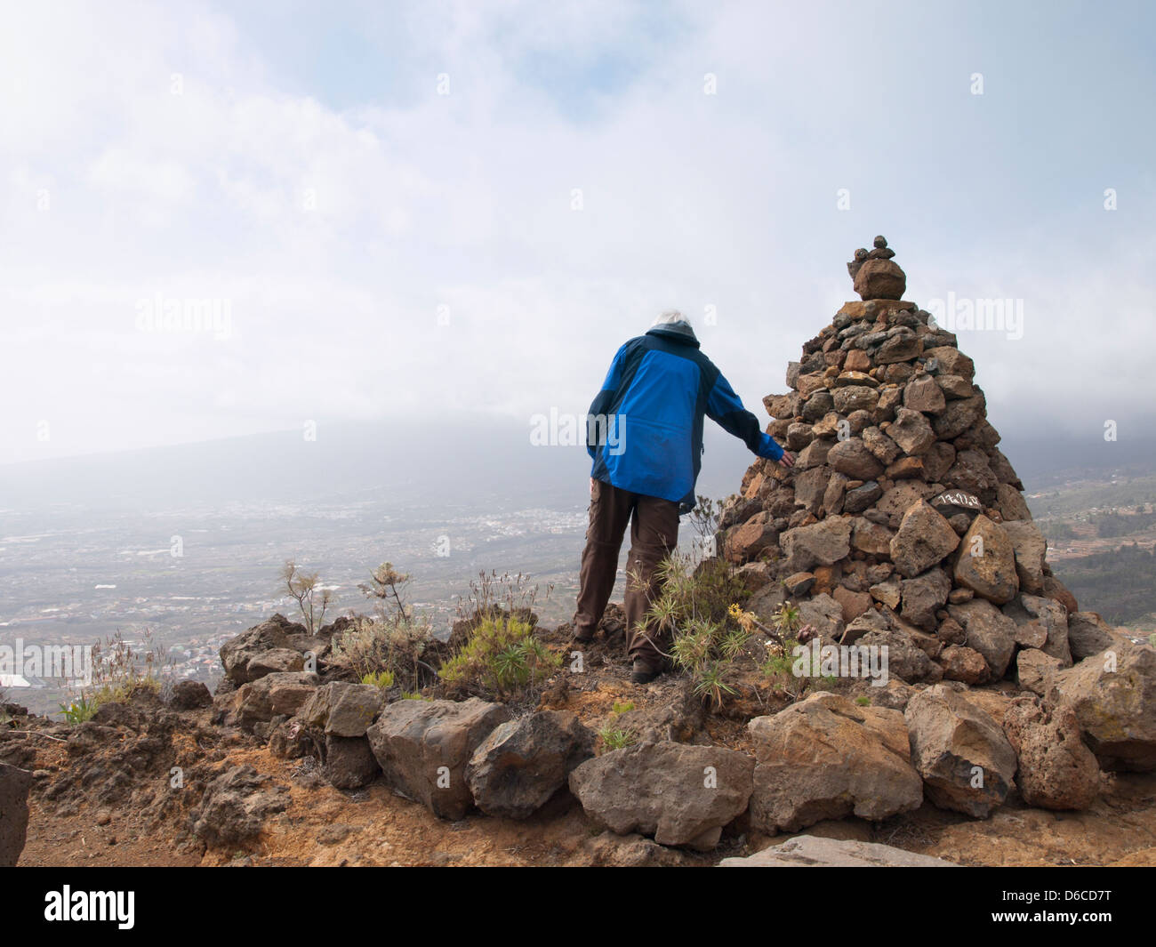 La Mesa, mountain plateau, a hiker on the edge looking down on Araya in ...