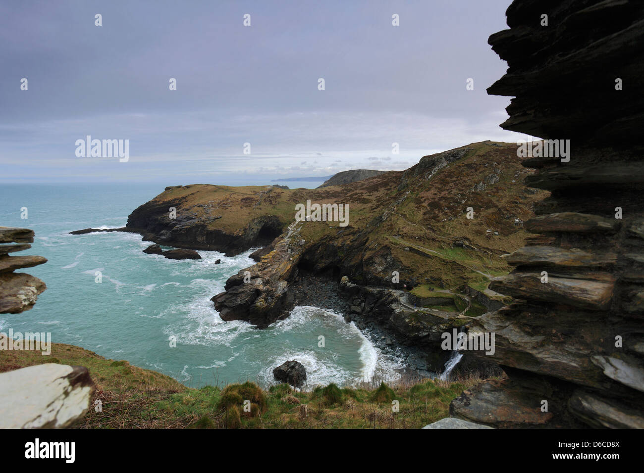 Dusk colours over the shore at Tintagel beach, Tintagel town, Cornwall ...