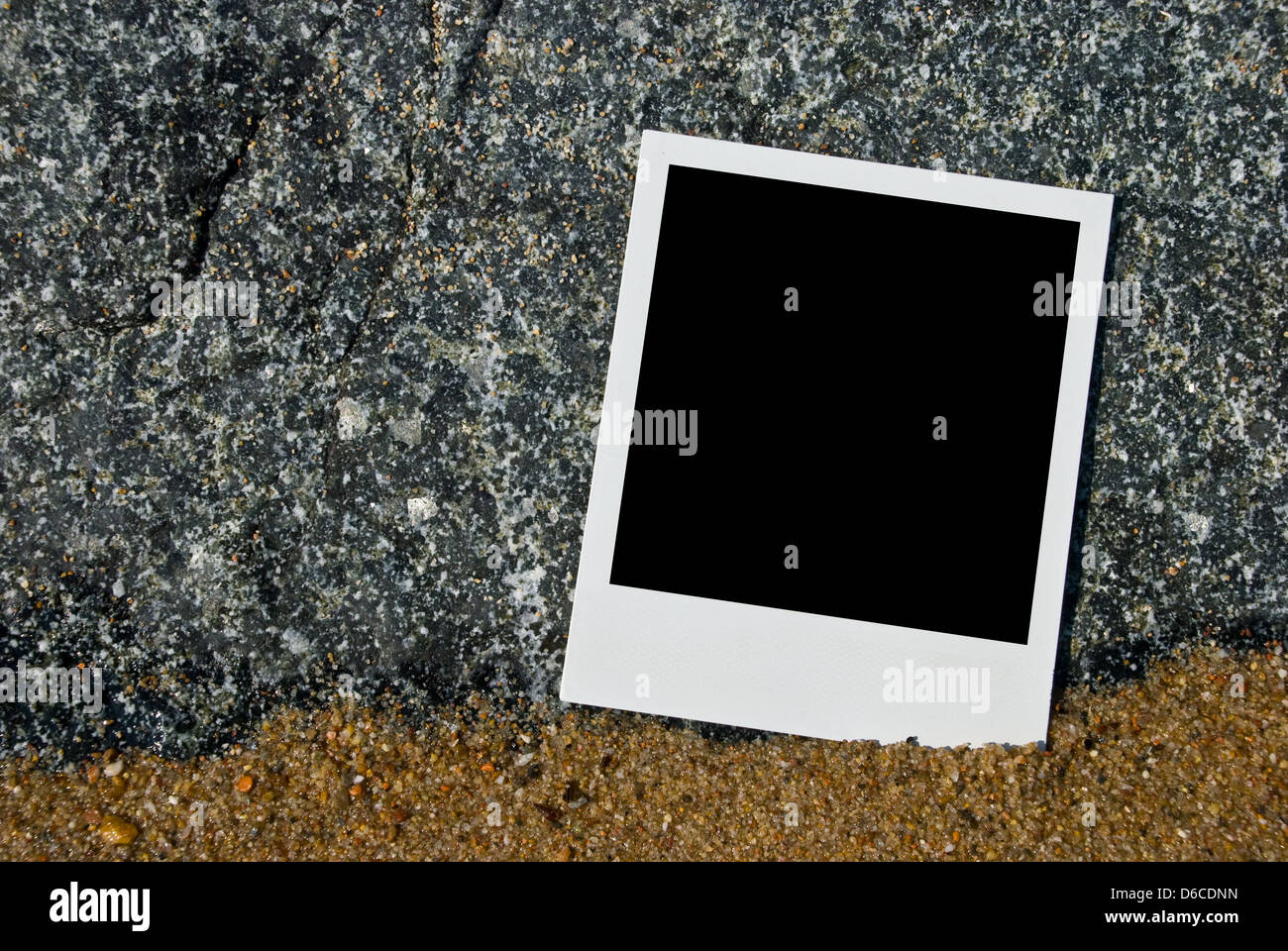 Photo frame on sand Stock Photo - Alamy