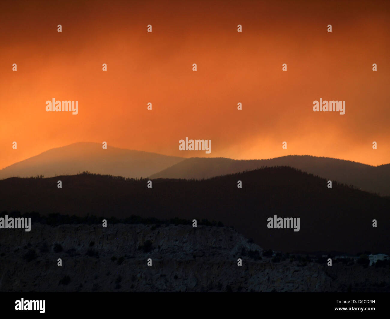 The image shows smoke rising over the Jemez Mountains near Los Alamos ...