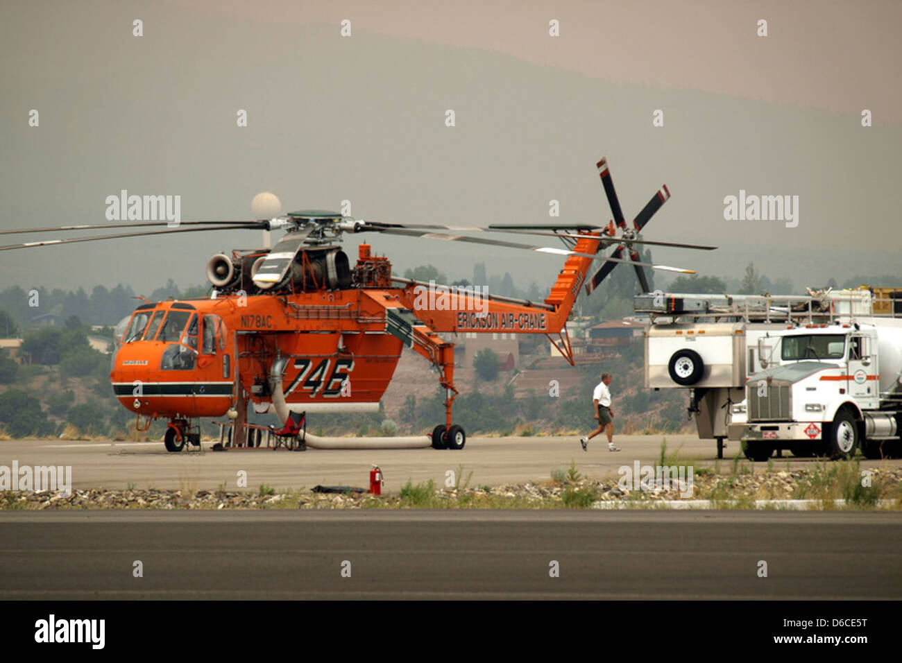 This image shows a sky crane helicopter operating at an airport in Los ...