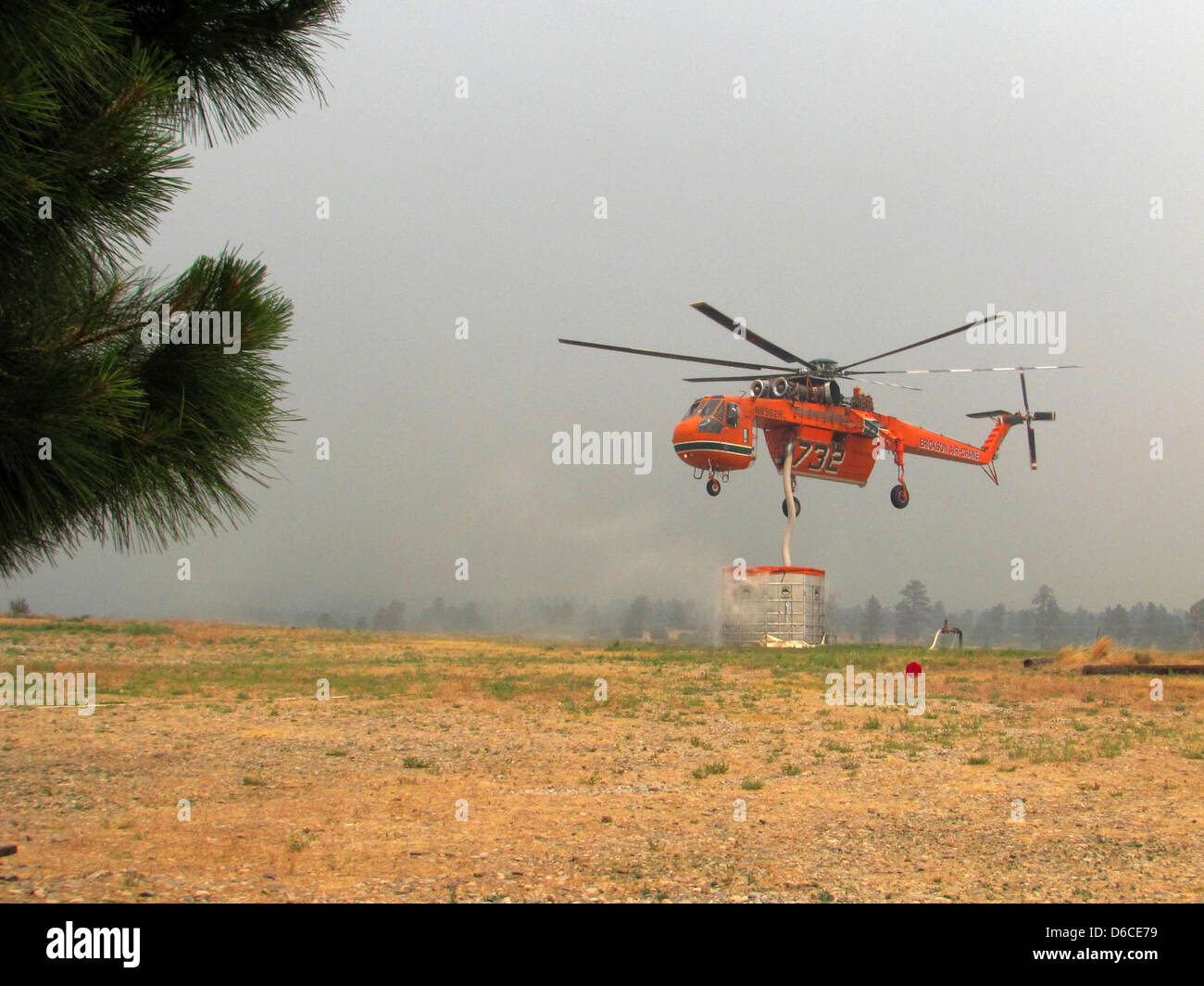 The Skycrane helicopter is seen in action during the Las Conchas Fire ...