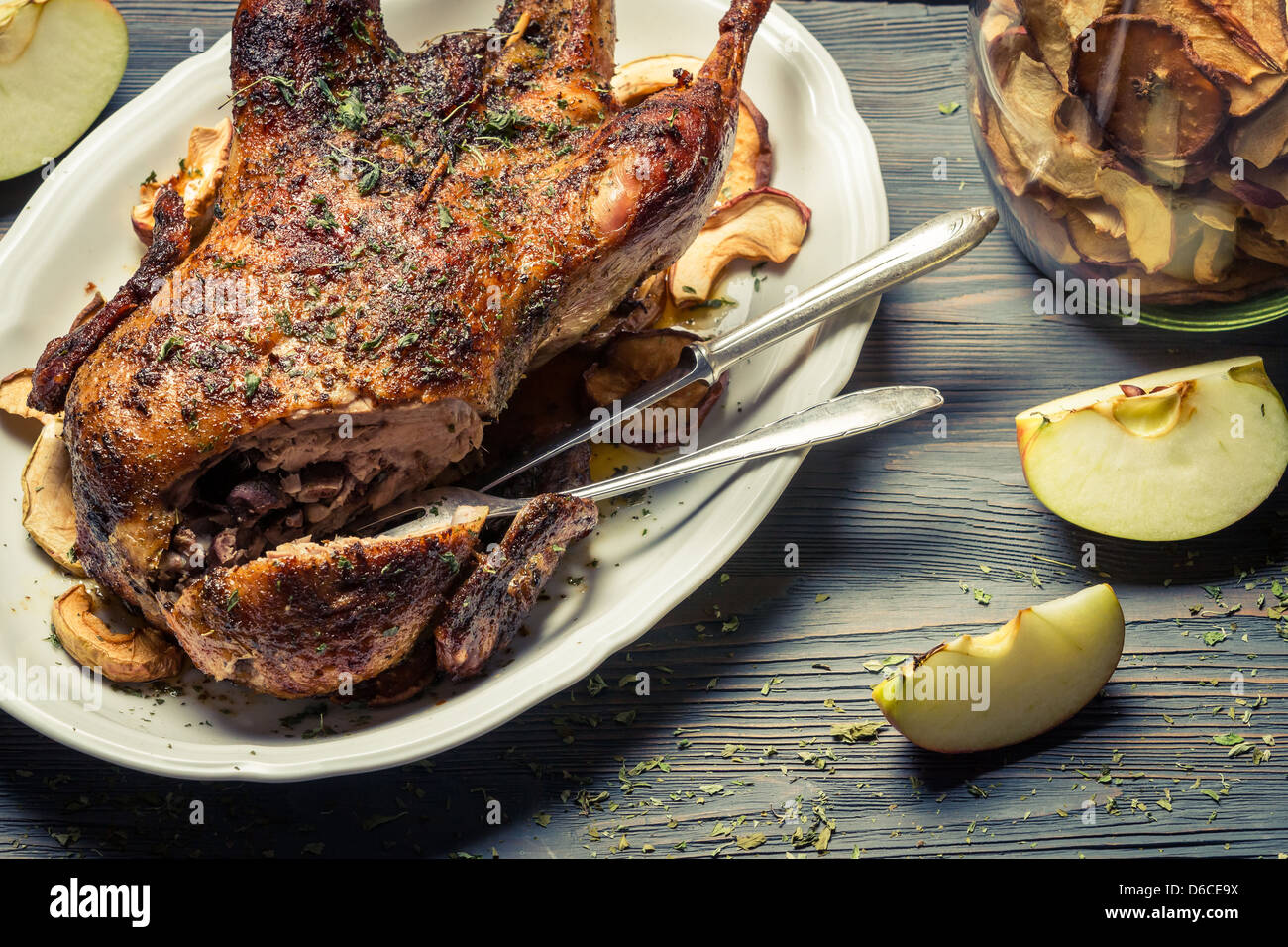 Closeup of fresh apples and roast duck Stock Photo - Alamy