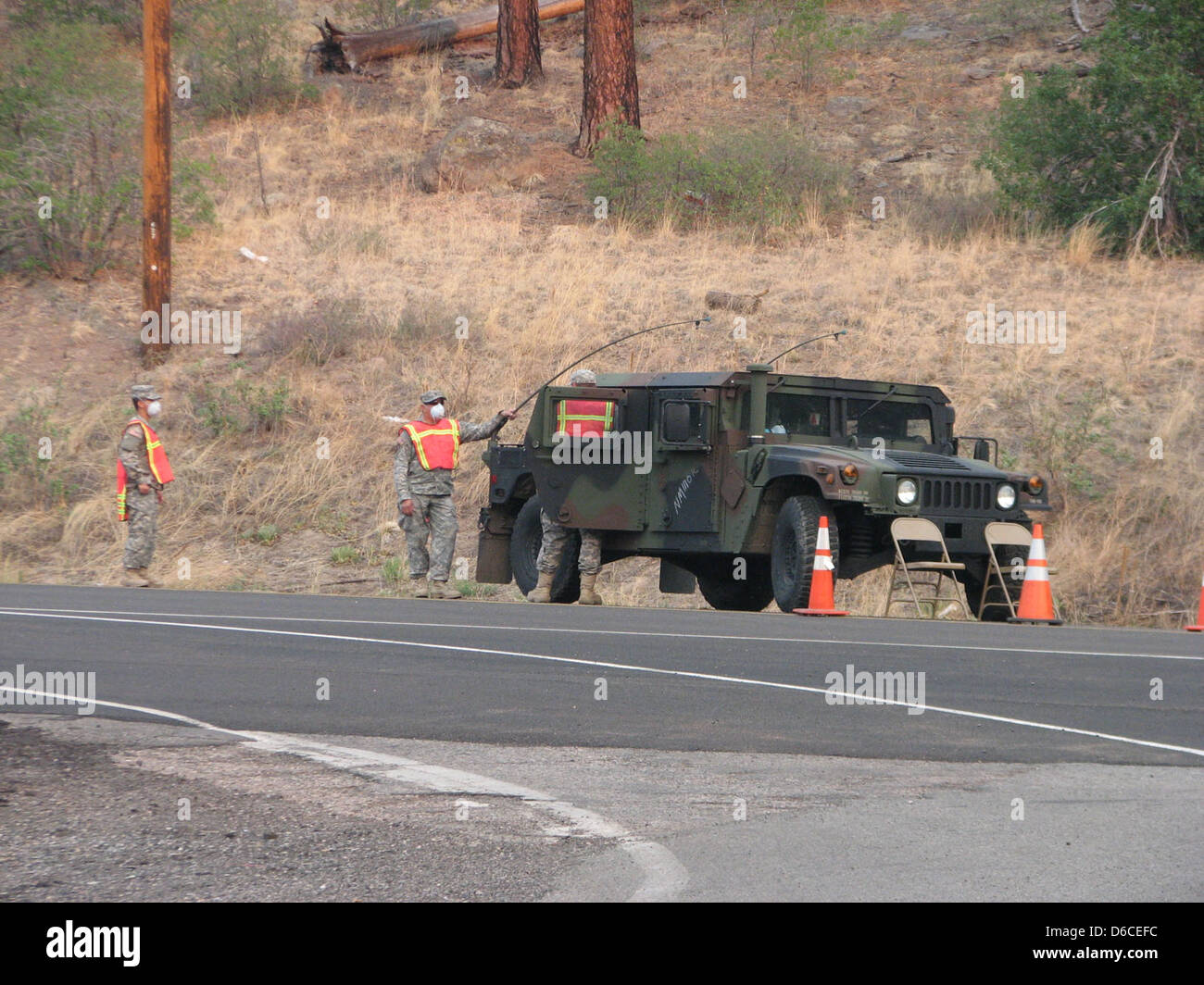 This photograph shows a National Guard checkpoint near Los Alamos ...