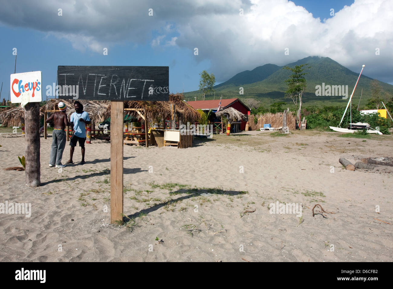 A sign posted in the sand on a beach in Nevis, advertises Internet ...