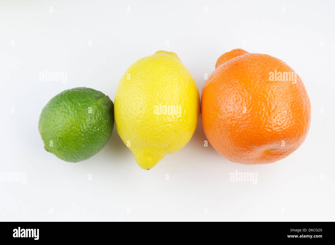 Lime,lemon and orange whole fruit on white background Stock Photo - Alamy