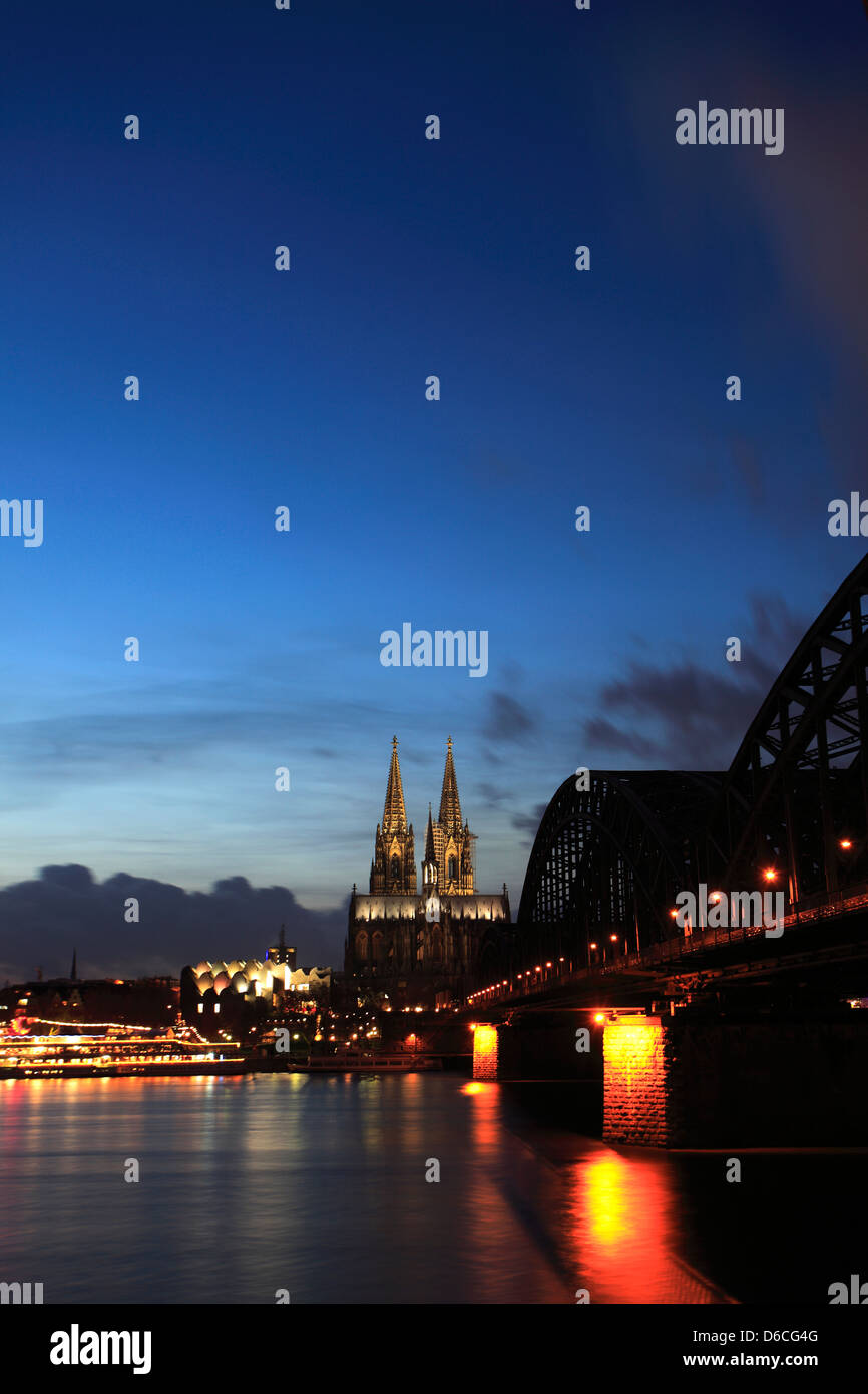 City view of Cologne at night with Cologne Cathedral, Rhine River ...