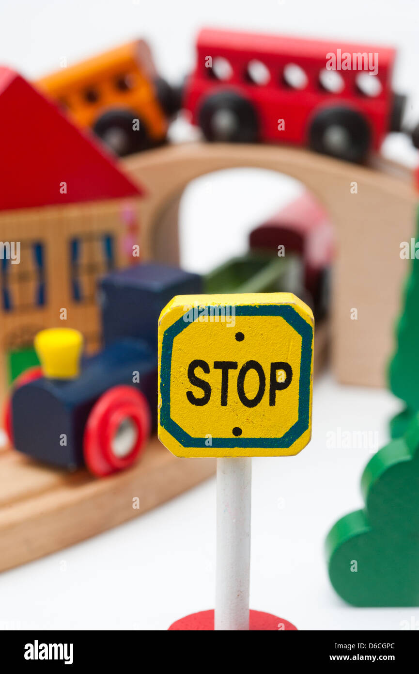 Wooden toy train set with stop sign Stock Photo - Alamy