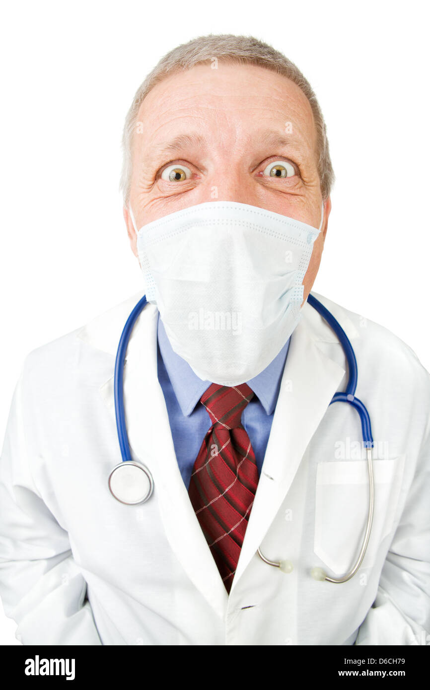 Mature doctor in mask staring at camera Stock Photo - Alamy