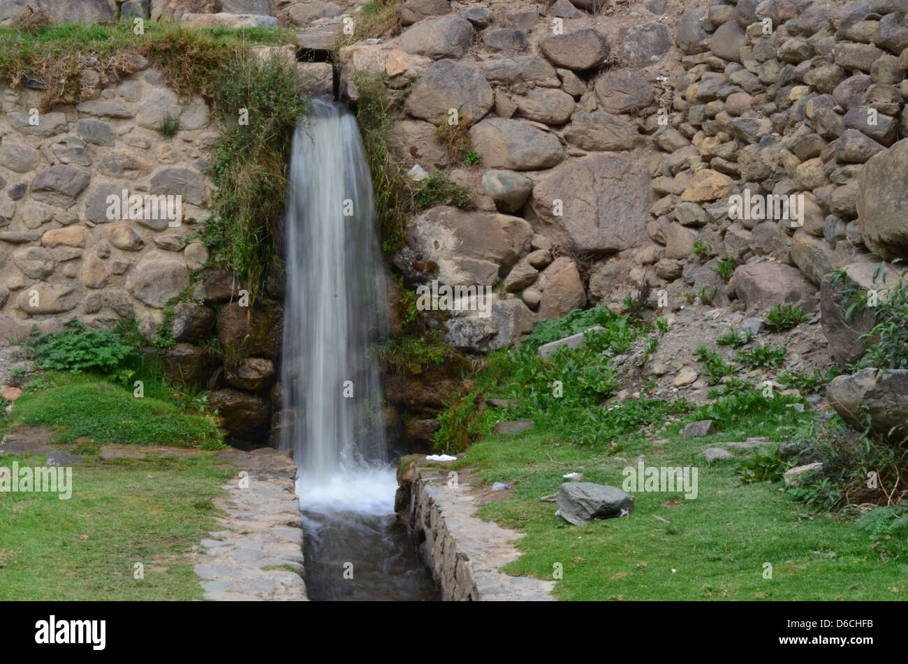 Inca stone water channels in the streets of Ollantaytambo, Peru Stock ...