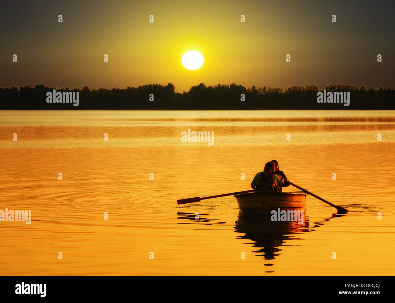 Relaxing at sunset Stock Photo - Alamy