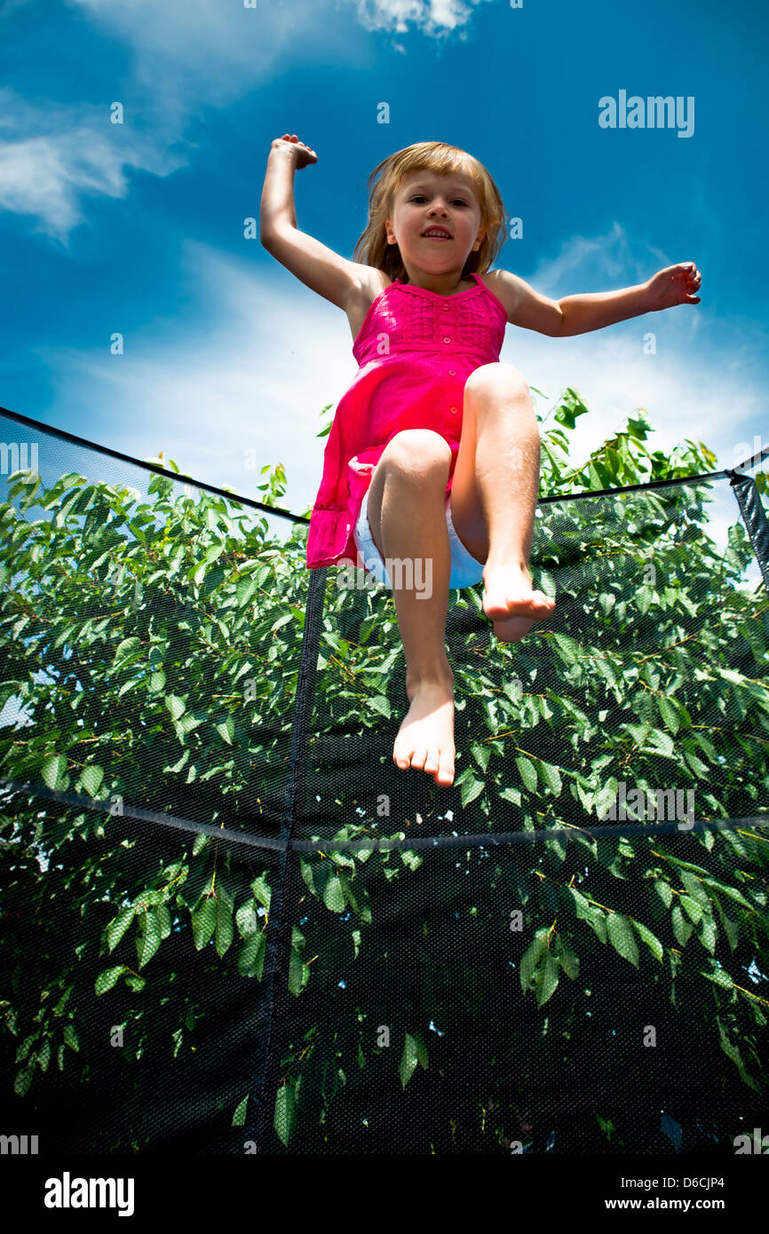 jumping in the garden Stock Photo - Alamy