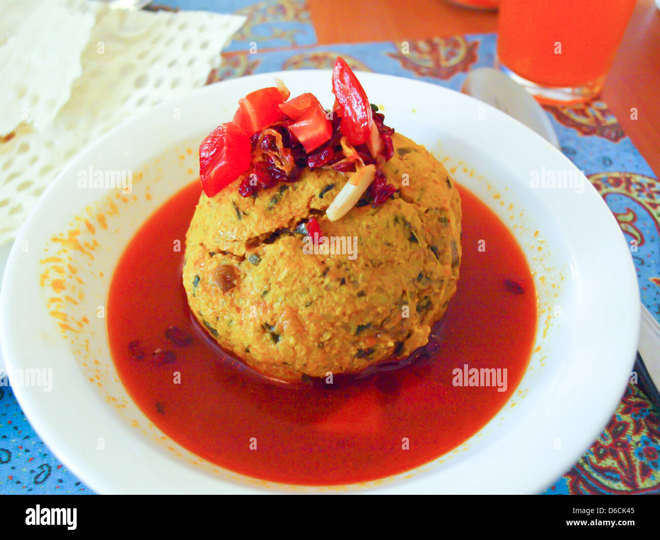 Iranian meatball, kebab, in a tomato sauce in white dish Stock Photo ...
